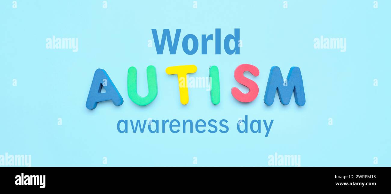 Text WORLD AUTISM AWARENESS DAY on light blue background Stock Photo ...