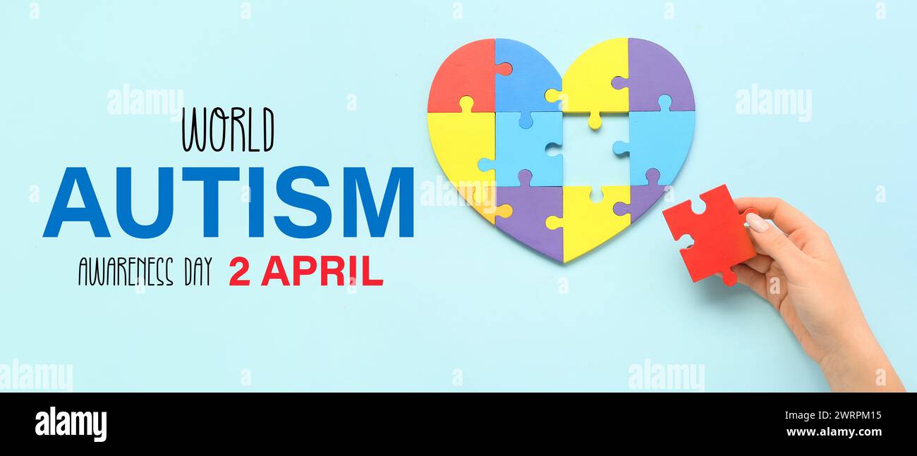 Hand with heart made of jigsaw puzzle pieces and text WORLD AUTISM ...