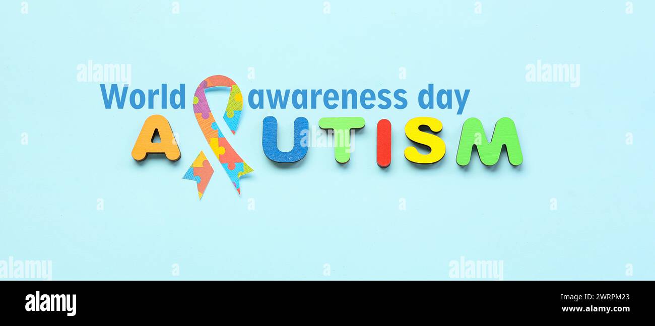 Text WORLD AUTISM AWARENESS DAY on light blue background Stock Photo ...