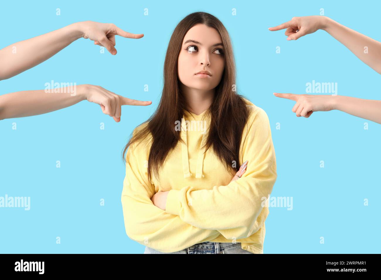 People pointing at young woman on blue background. Accusation concept ...