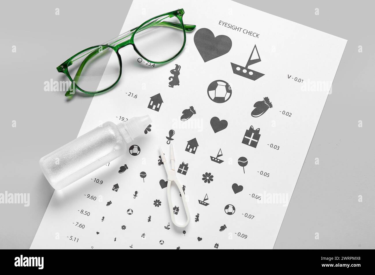 Stylish eyeglasses with eye test chart, tweezers and solution for ...