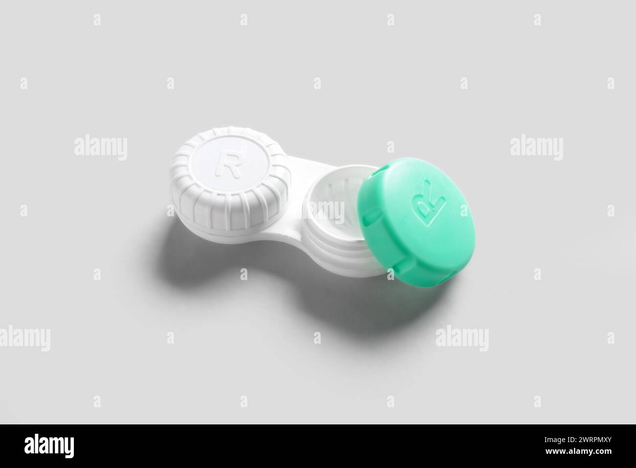 Container for contact lenses on white background Stock Photo - Alamy