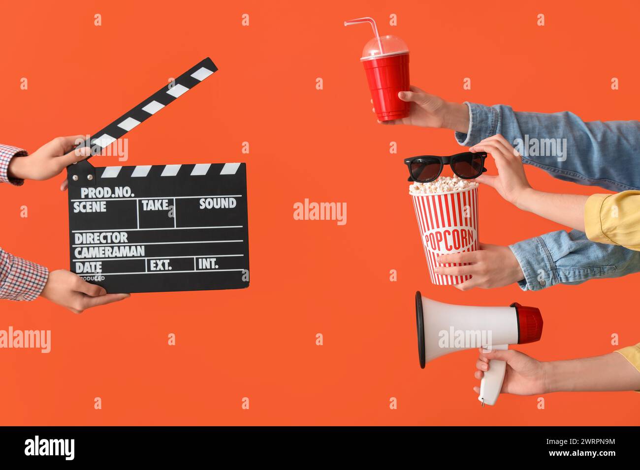 Many hands with bucket of popcorn, movie clapper and megaphone on ...