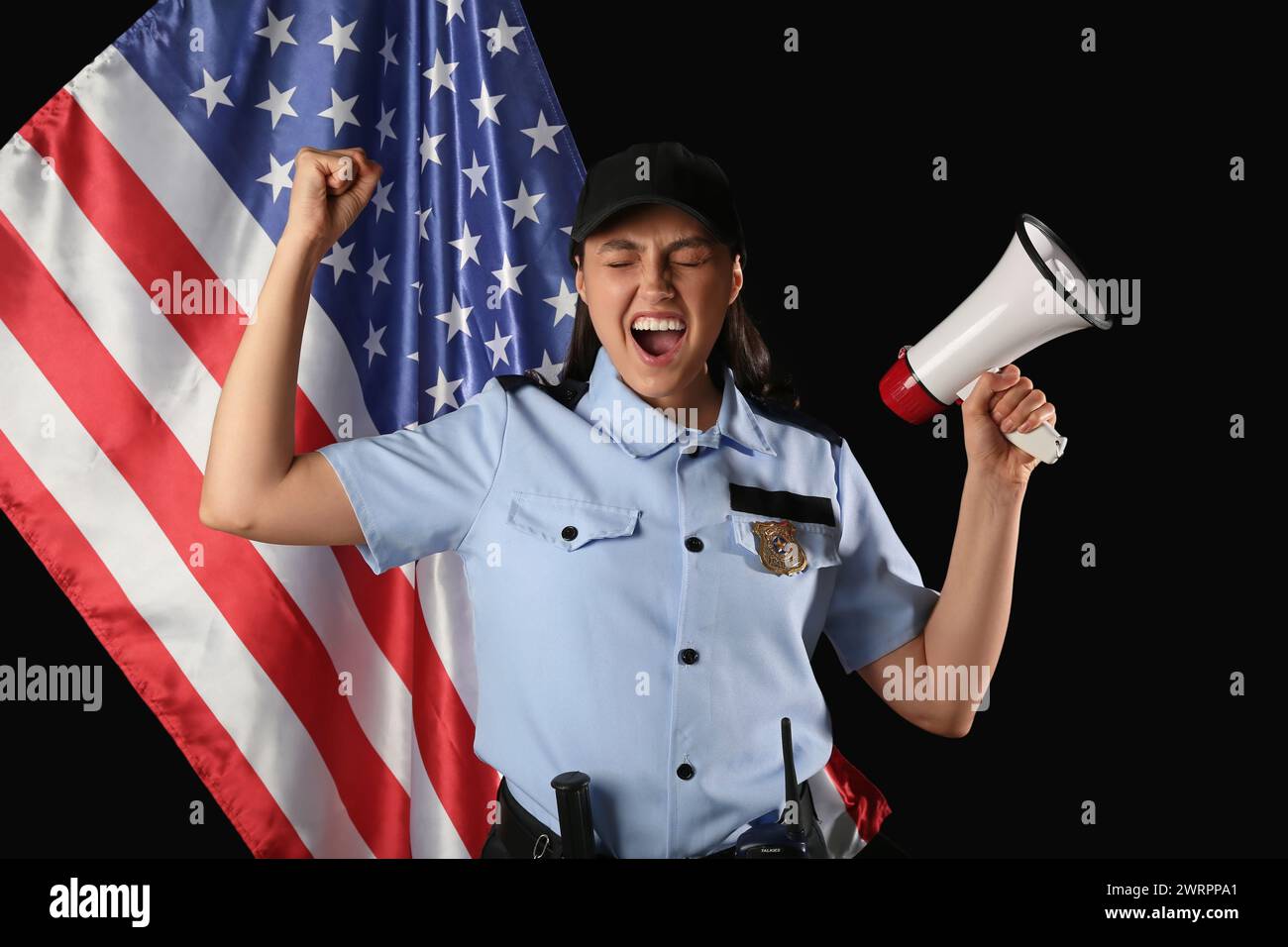 Screaming female police officer with megaphone and flag of USA on black ...