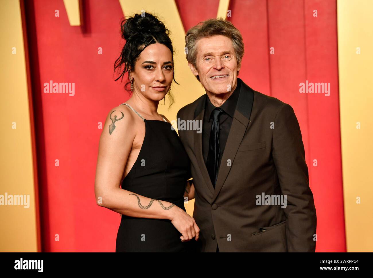 Willem Dafoe, right, and wife Giada Colagrande arrive at the Vanity ...