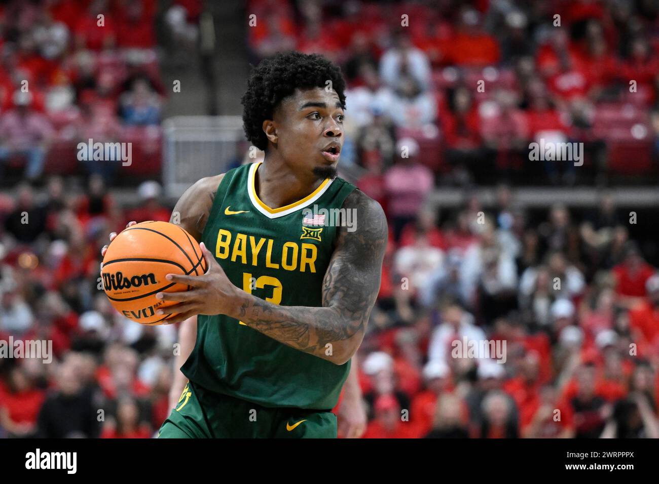 Baylor guard Langston Love controls the ball against Texas Tech during ...