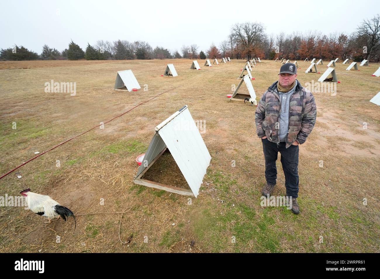 Troy Thompson, owner of Troy Farms poses for The Associated Press near ...