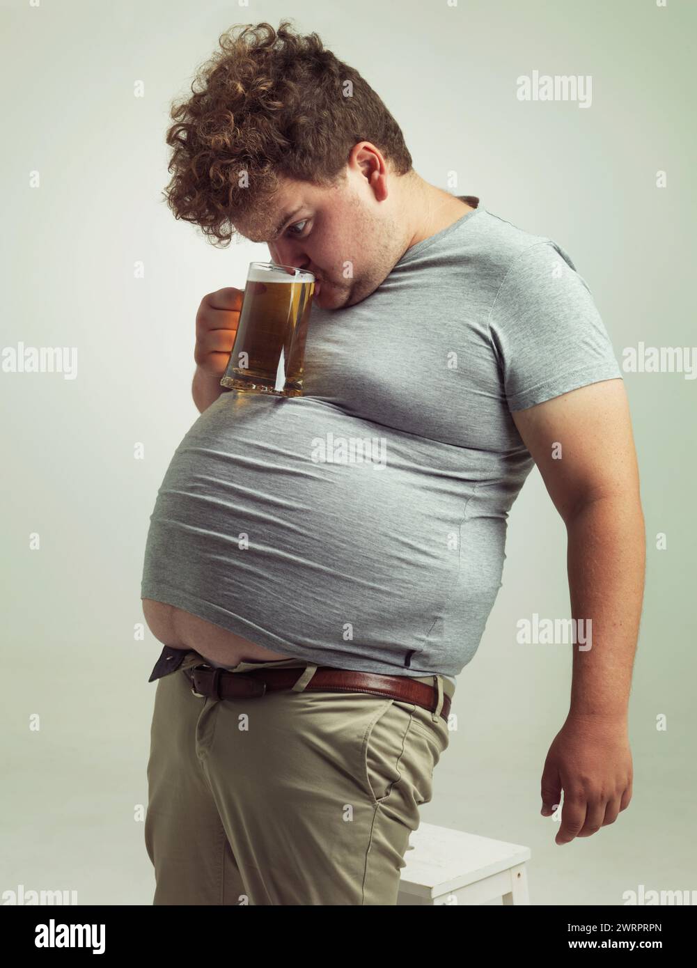 Obese, weight gain and alcohol for man in studio with drink for ...