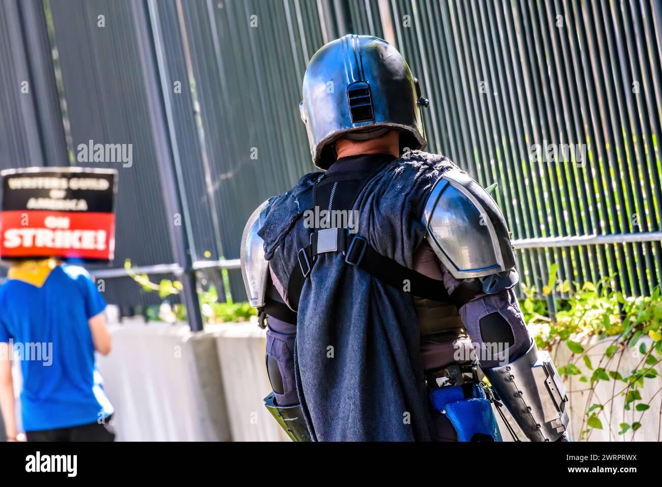 An actor, Tim Brehmer dressed as the Star Wars character, Mandalorian ...