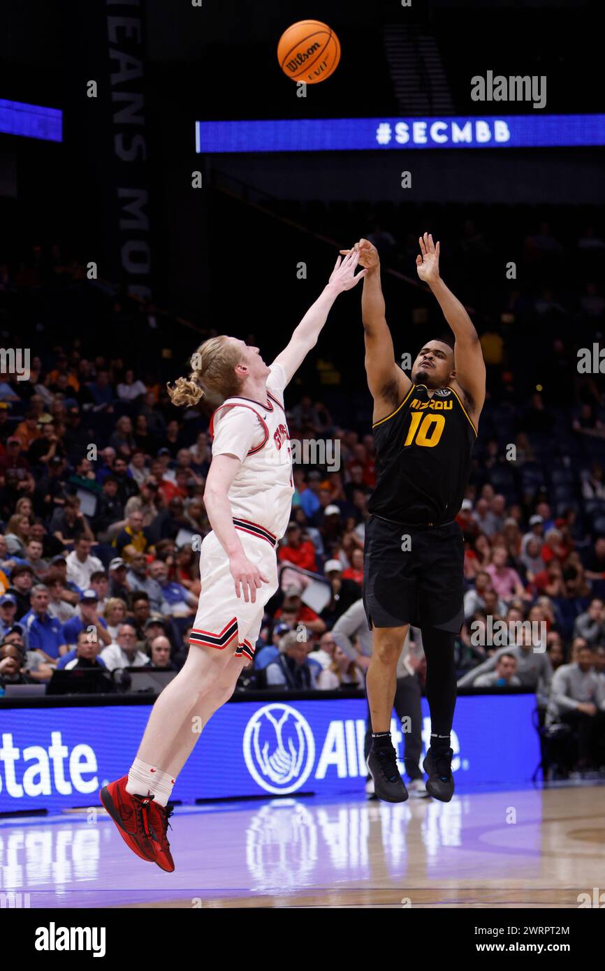 NASHVILLE, TN - MARCH 13: Missouri Tigers guard Nick Honor (10) shoots a 3-pointer over Georgia ...