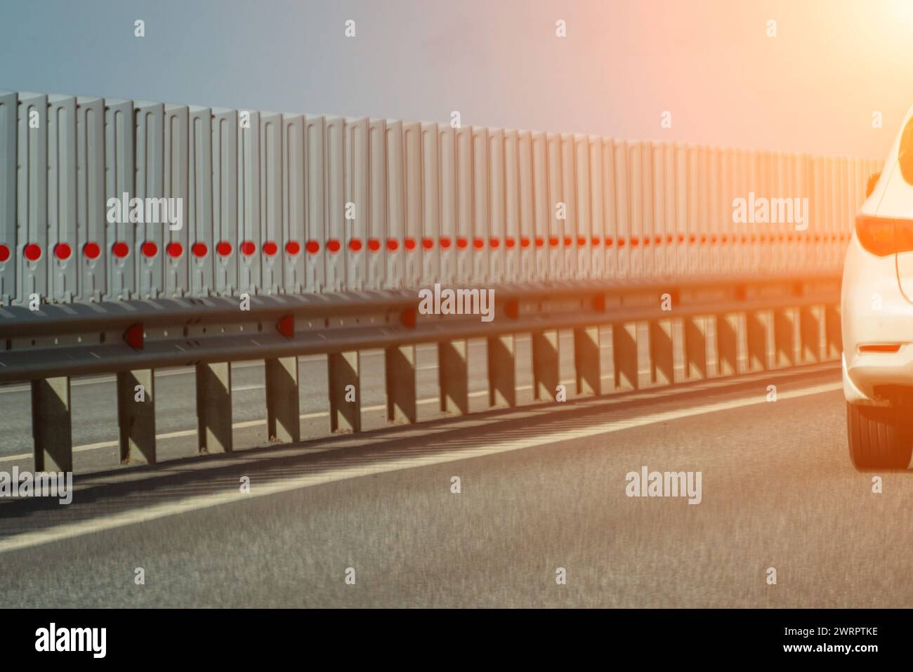 Safety barriers on highway. Anodized safety steel barrier. Enhancing ...