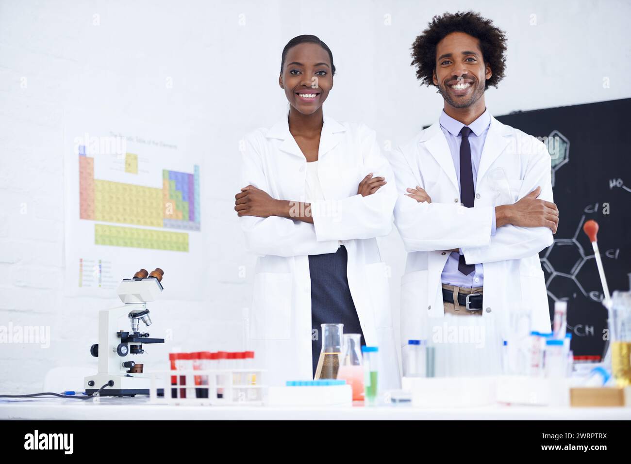 Scientist, portrait and arms crossed with teamwork in laboratory for ...