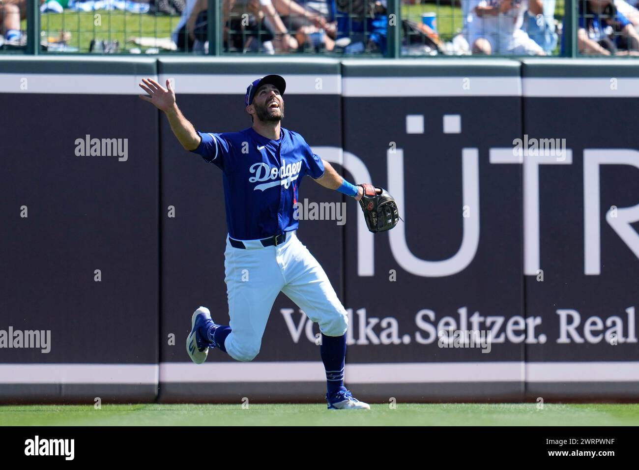 Los Angeles Dodgers left fielder Chris Taylor runs down a fly ball ...