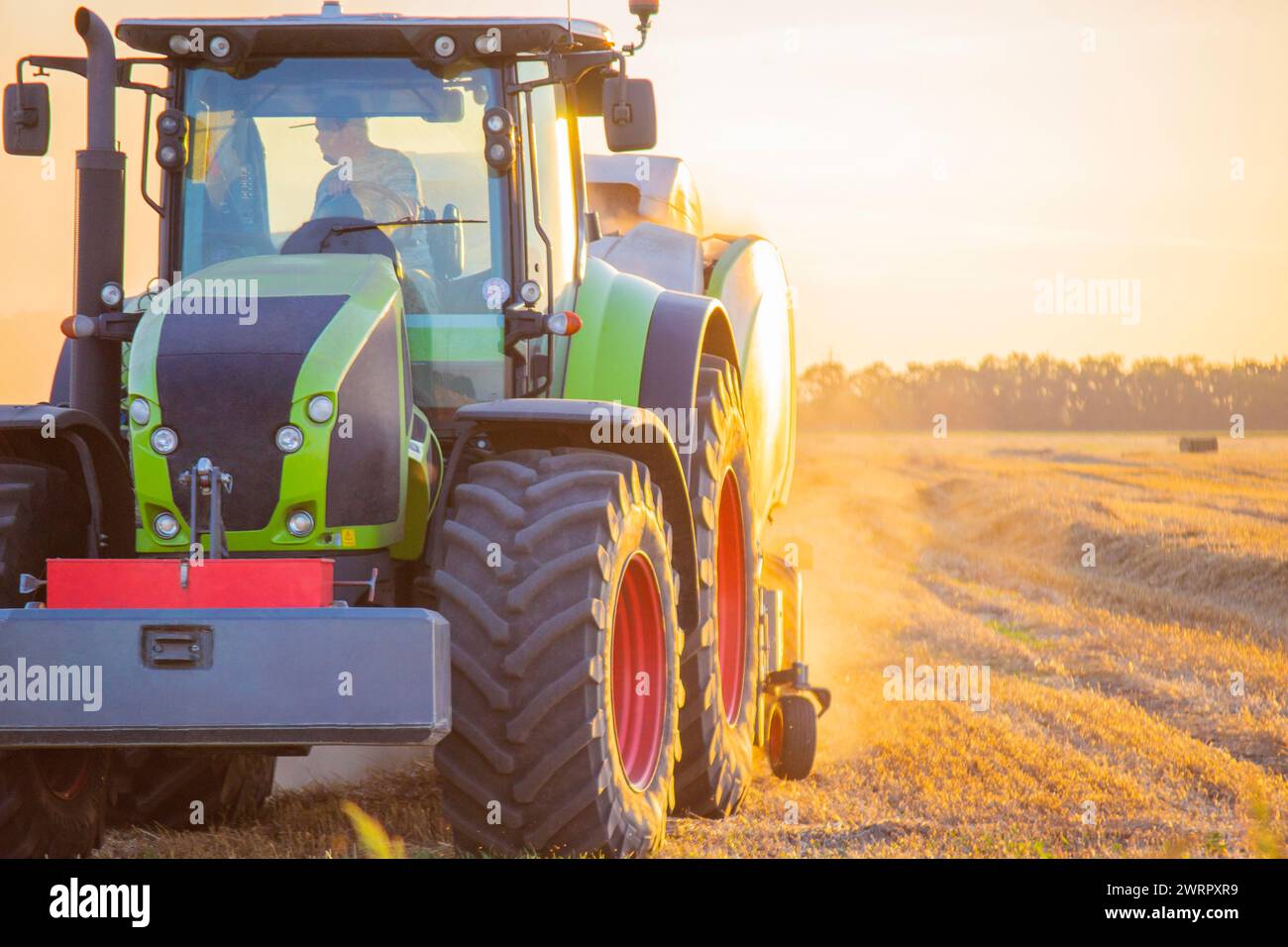 Big tractor rides on field hi-res stock photography and images - Alamy