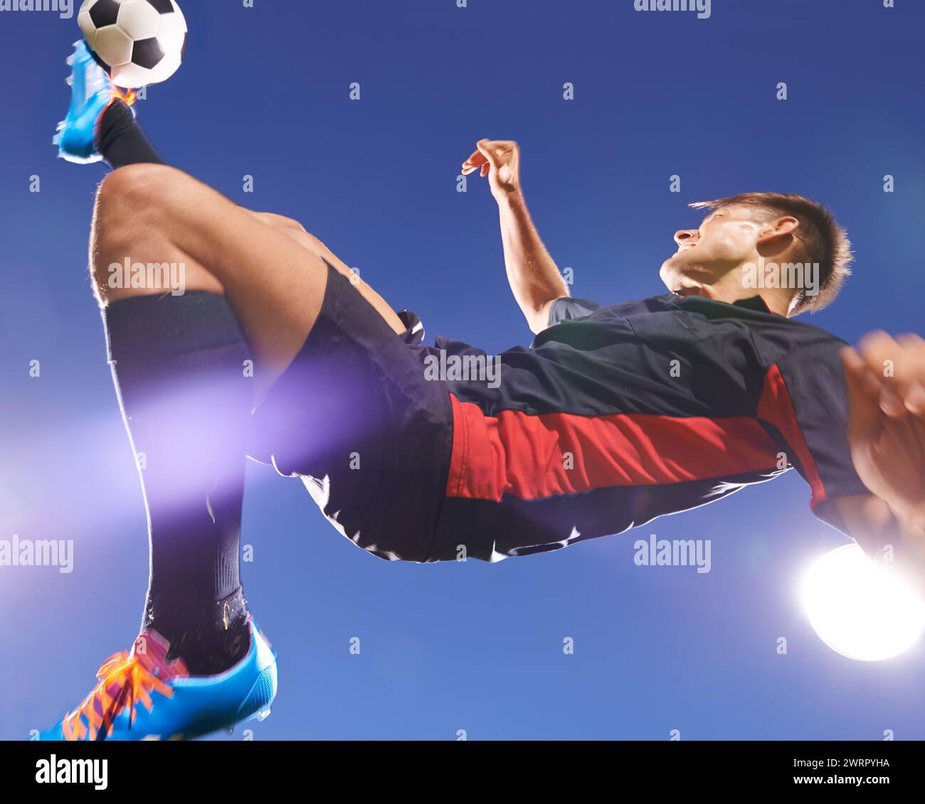 Football player, jump and kick with man and soccer ball, energy and ...