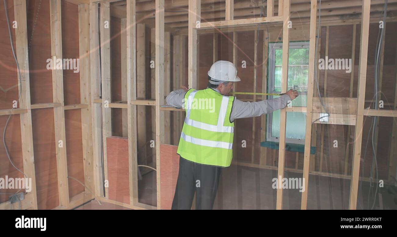 Image of statistics processing over male engineer measuring at ...