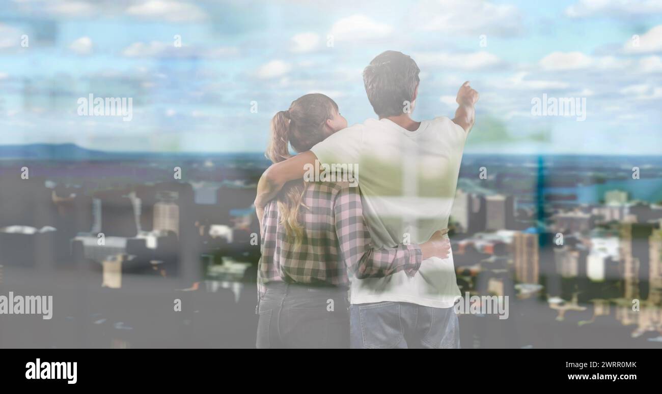 Image of windows over couple embracing looking at cityscape Stock Photo ...