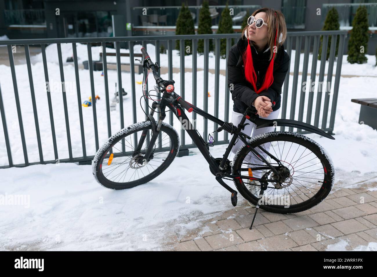 A woman stopped while cycling to rest Stock Photo - Alamy