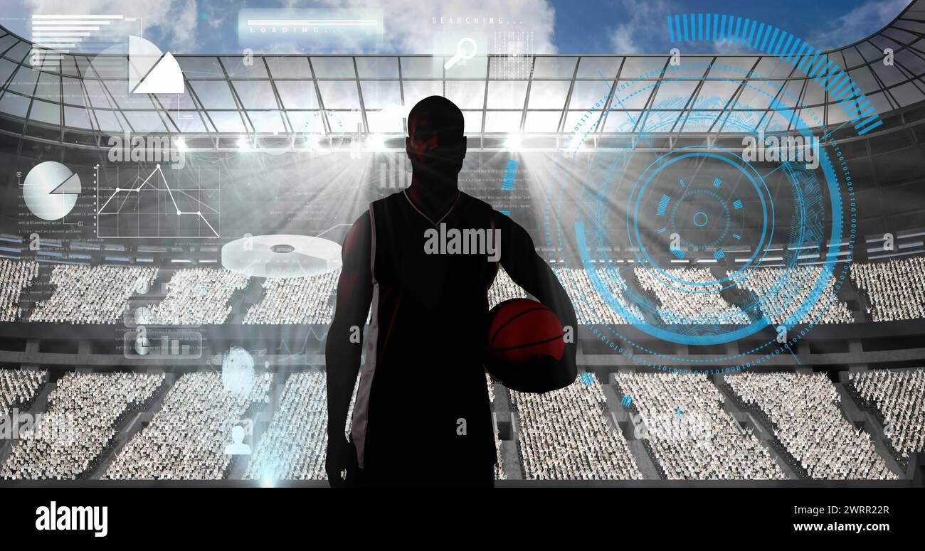 Confetti falling over silhouette of male basketball player holding ...