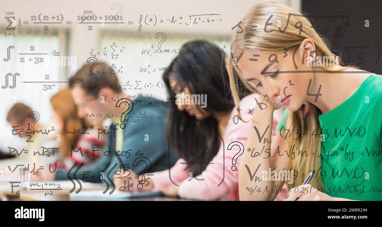 Image of mathematical equations over diverse students in classroom ...