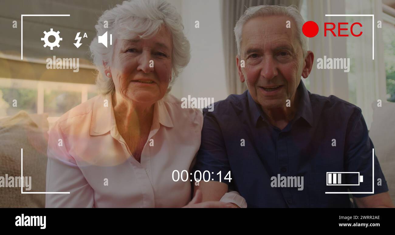 Image of play screen over caucasian senior couple Stock Photo - Alamy