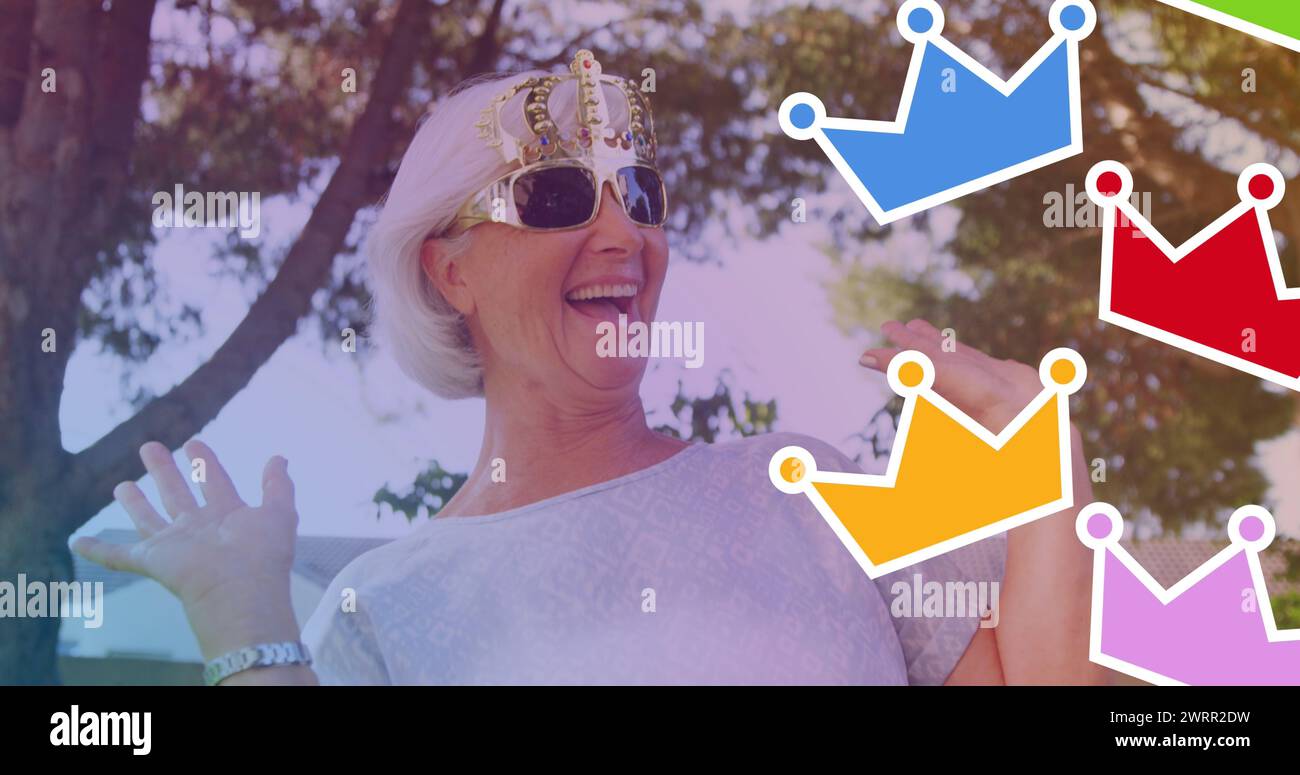 Image of falling crowns over happy caucasian women Stock Photo - Alamy