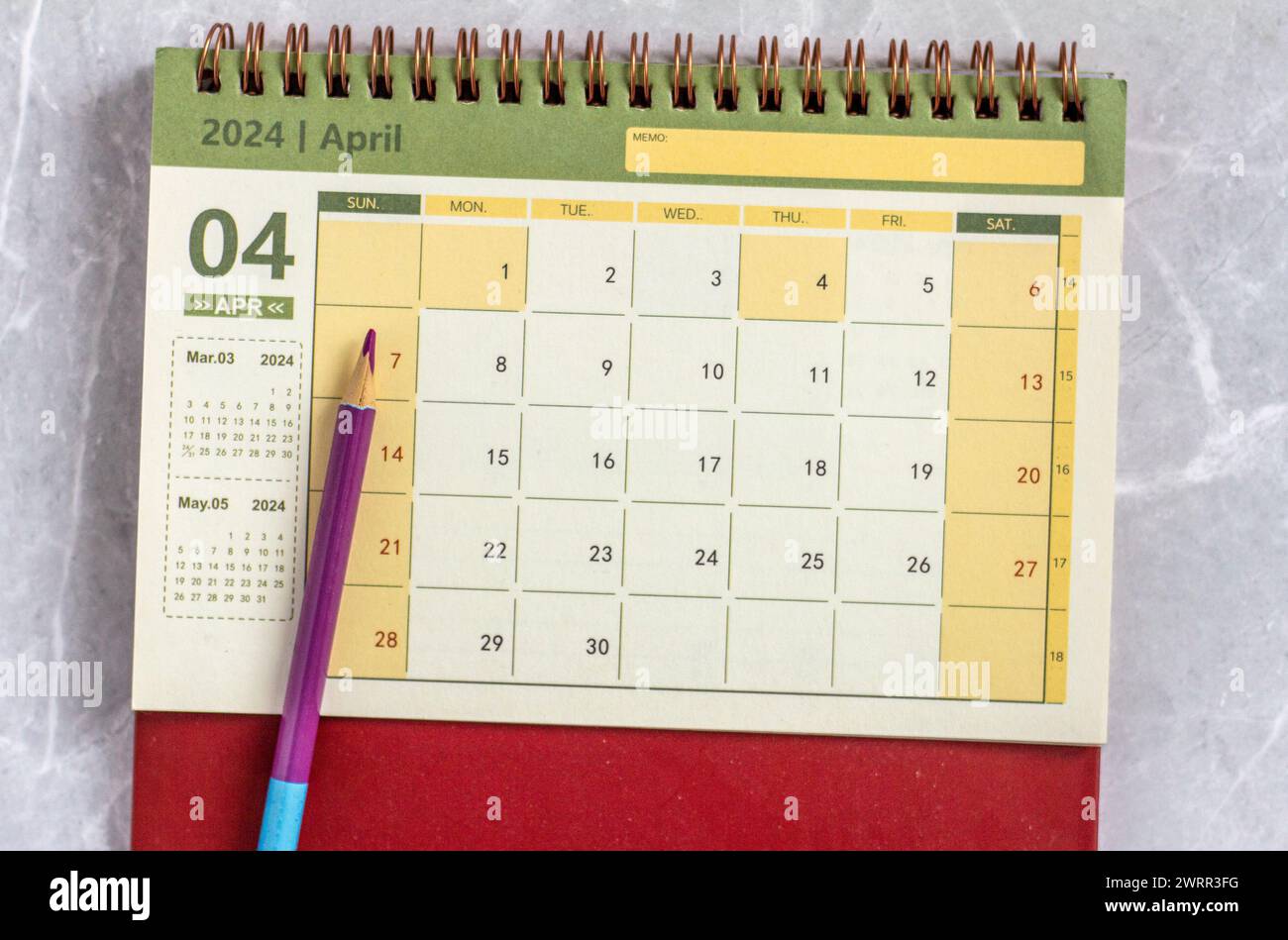 Calendar for April 2024 on a marble background Stock Photo - Alamy