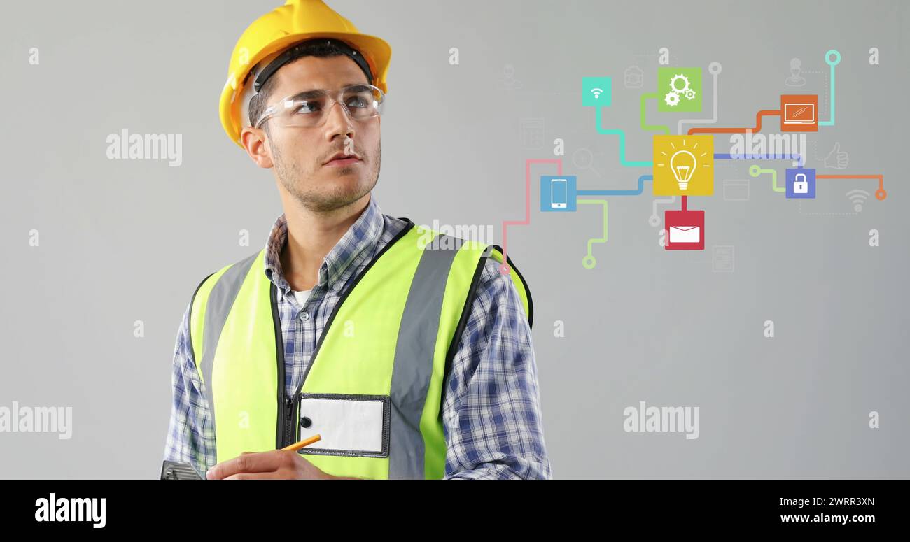 Digital interface with media icons overlays engineer noting on ...