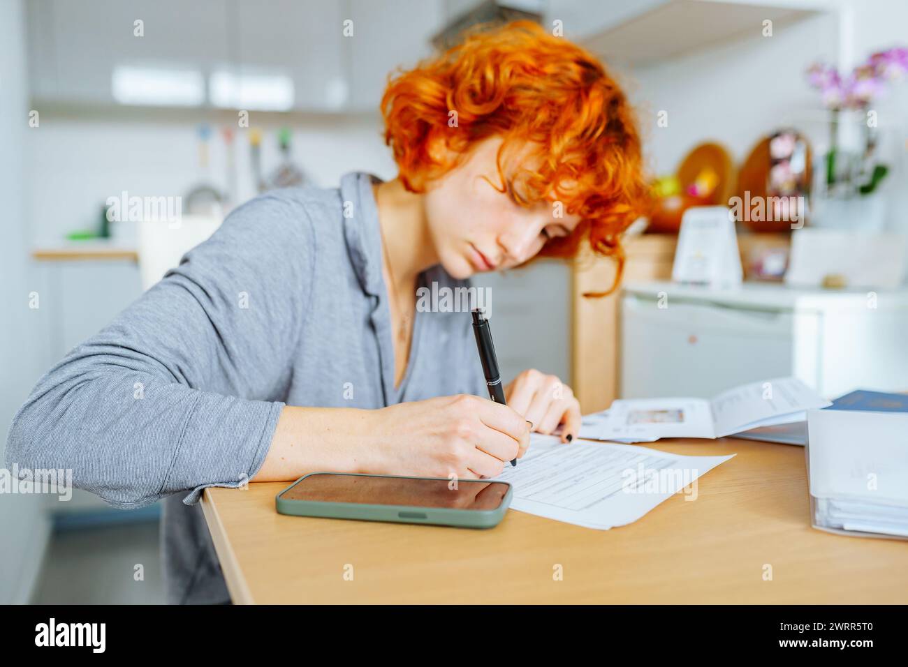 portrait attractive teenage girl filling out paper form Stock Photo - Alamy