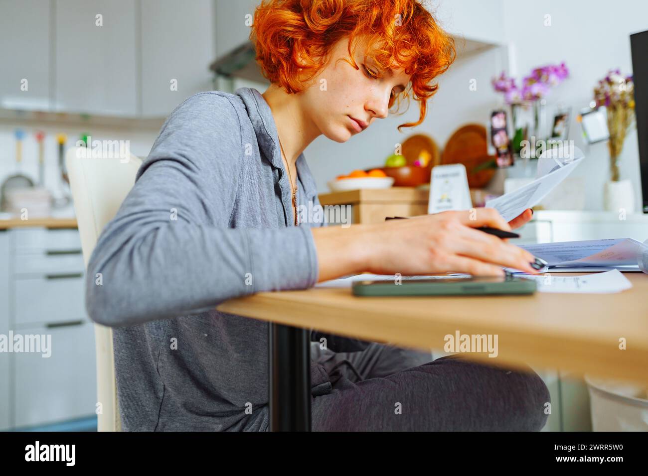 portrait attractive teenage girl filling out paper form Stock Photo - Alamy
