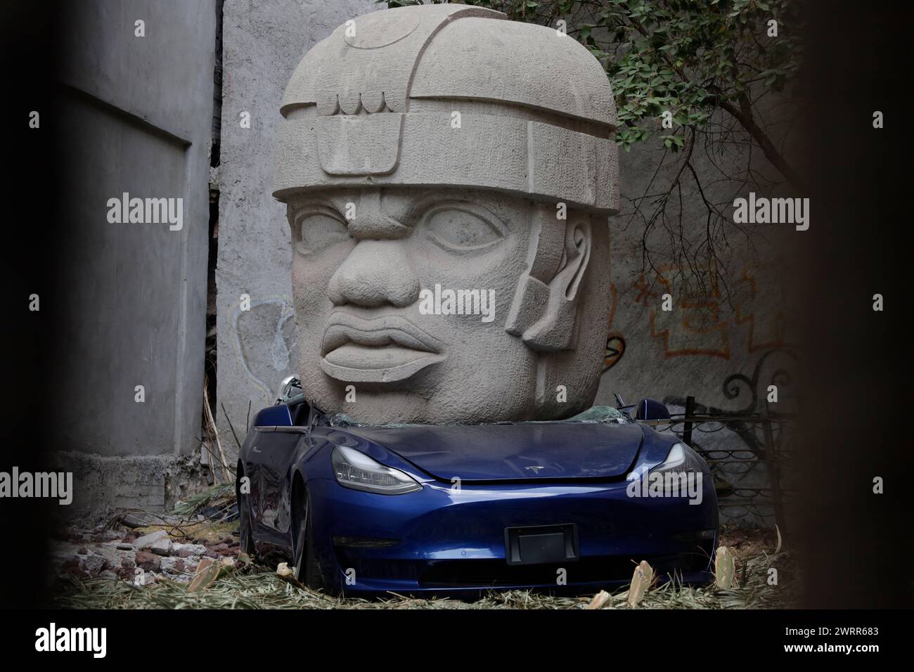 Colossal olmec head replica crushing a tesla in mexico city hi-res ...