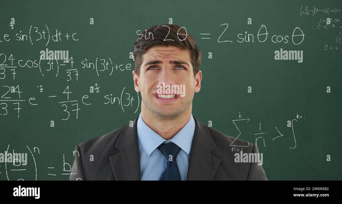 Confused male student with math equations on screen for back to school ...
