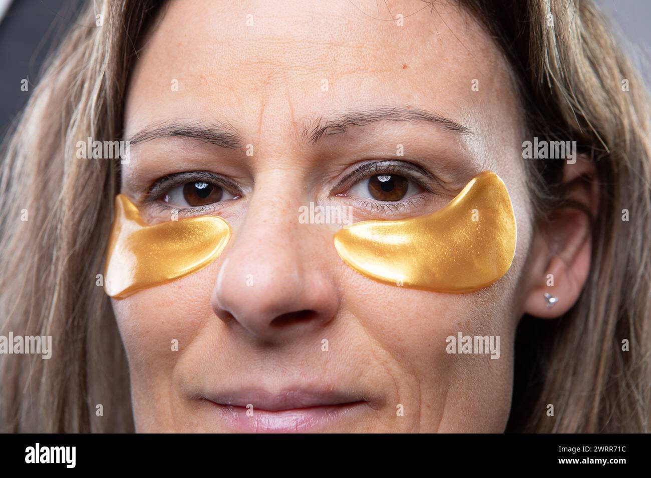 Young woman golden patches hi-res stock photography and images - Alamy