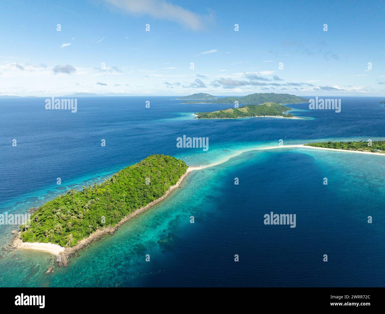 Islands with beaches surrounded by blue sea. Blue sky and clouds ...
