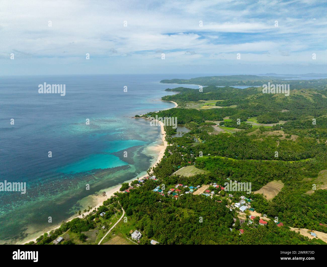 Tropical Island with farmlands and white beach at coast. Santa Fe ...
