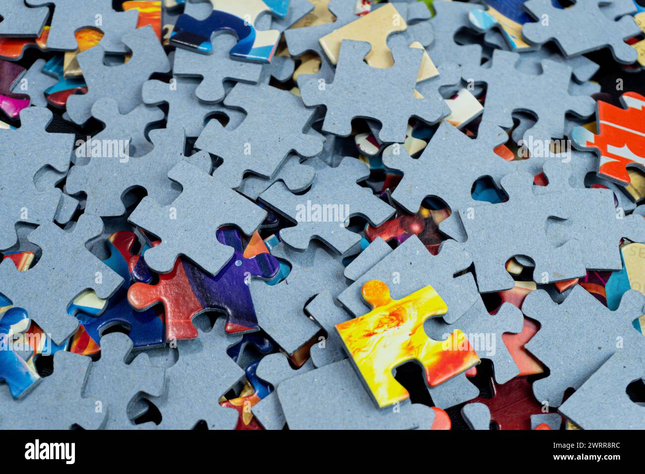 Stacked puzzle pieces that are not completed Stock Photo - Alamy
