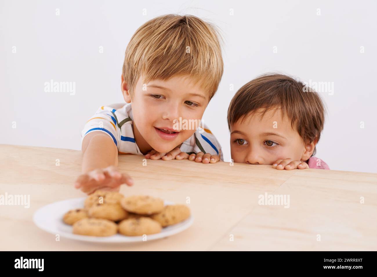 Boys eating cookies hi-res stock photography and images - Alamy