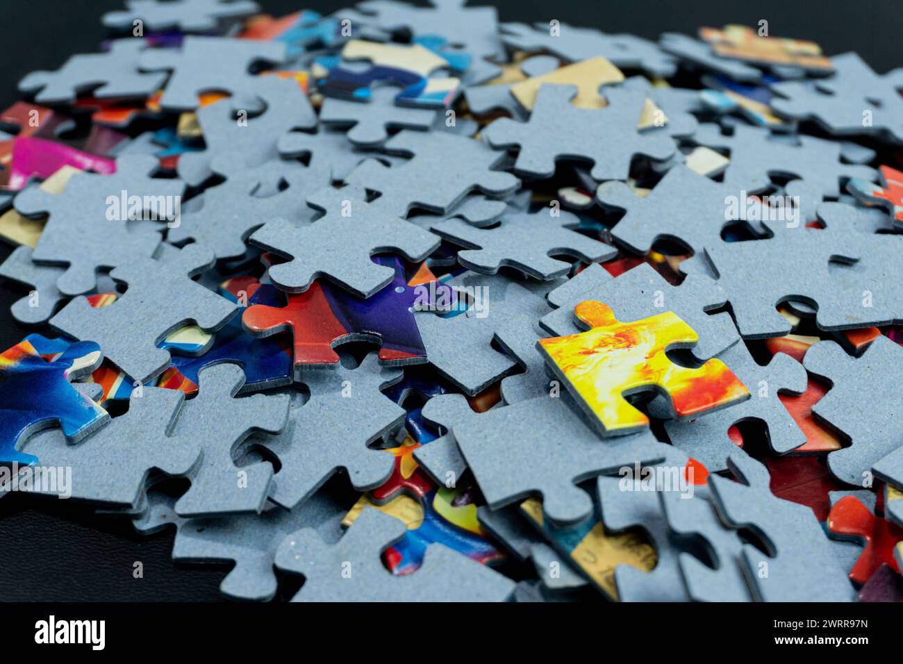 Stacked puzzle pieces that are not completed Stock Photo - Alamy