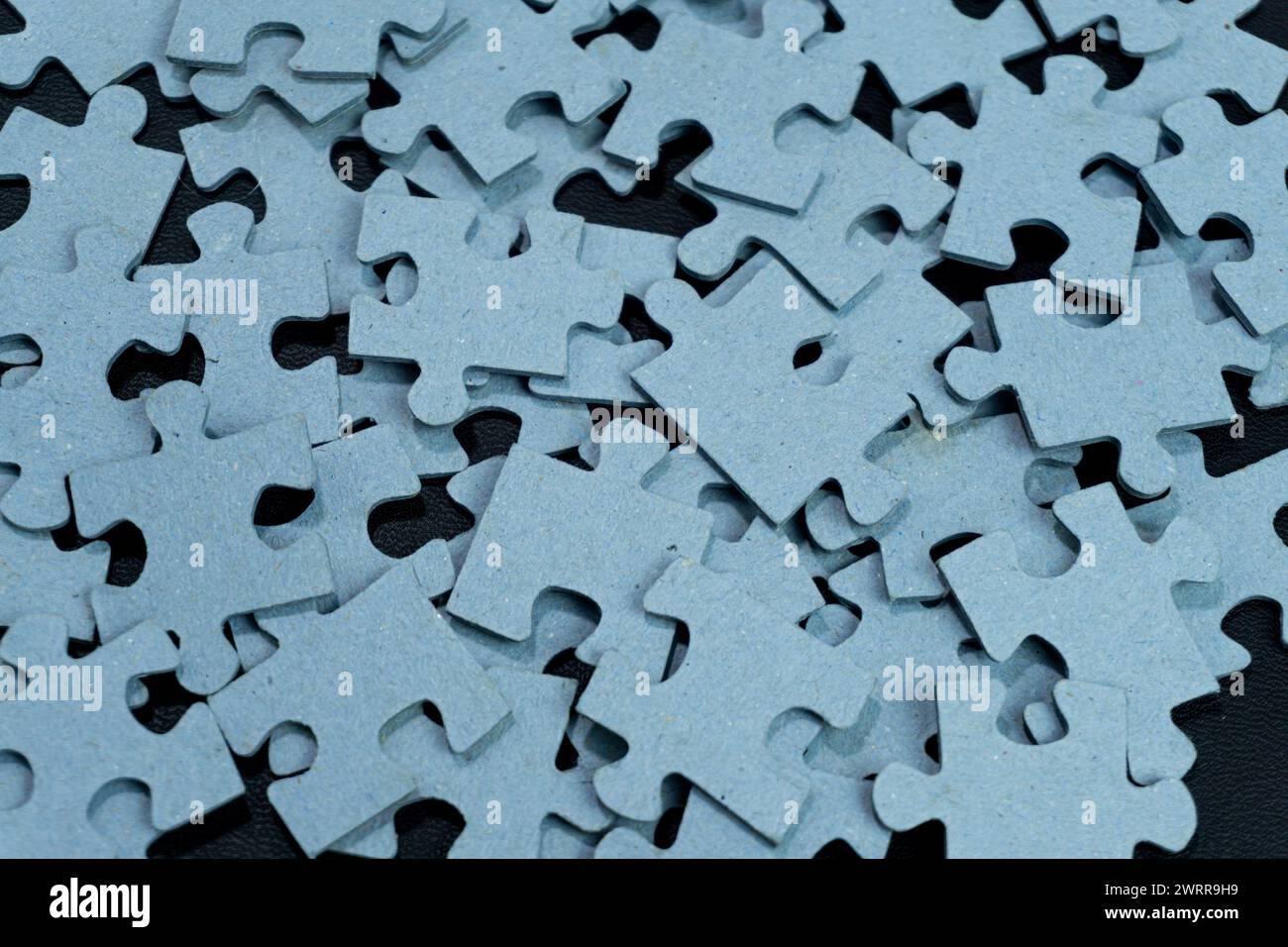 Stacked puzzle pieces that are not completed Stock Photo - Alamy