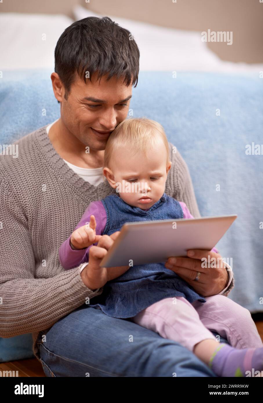Tablet, search or father and baby on a floor for cartoon, streaming or gaming while bonding at ...