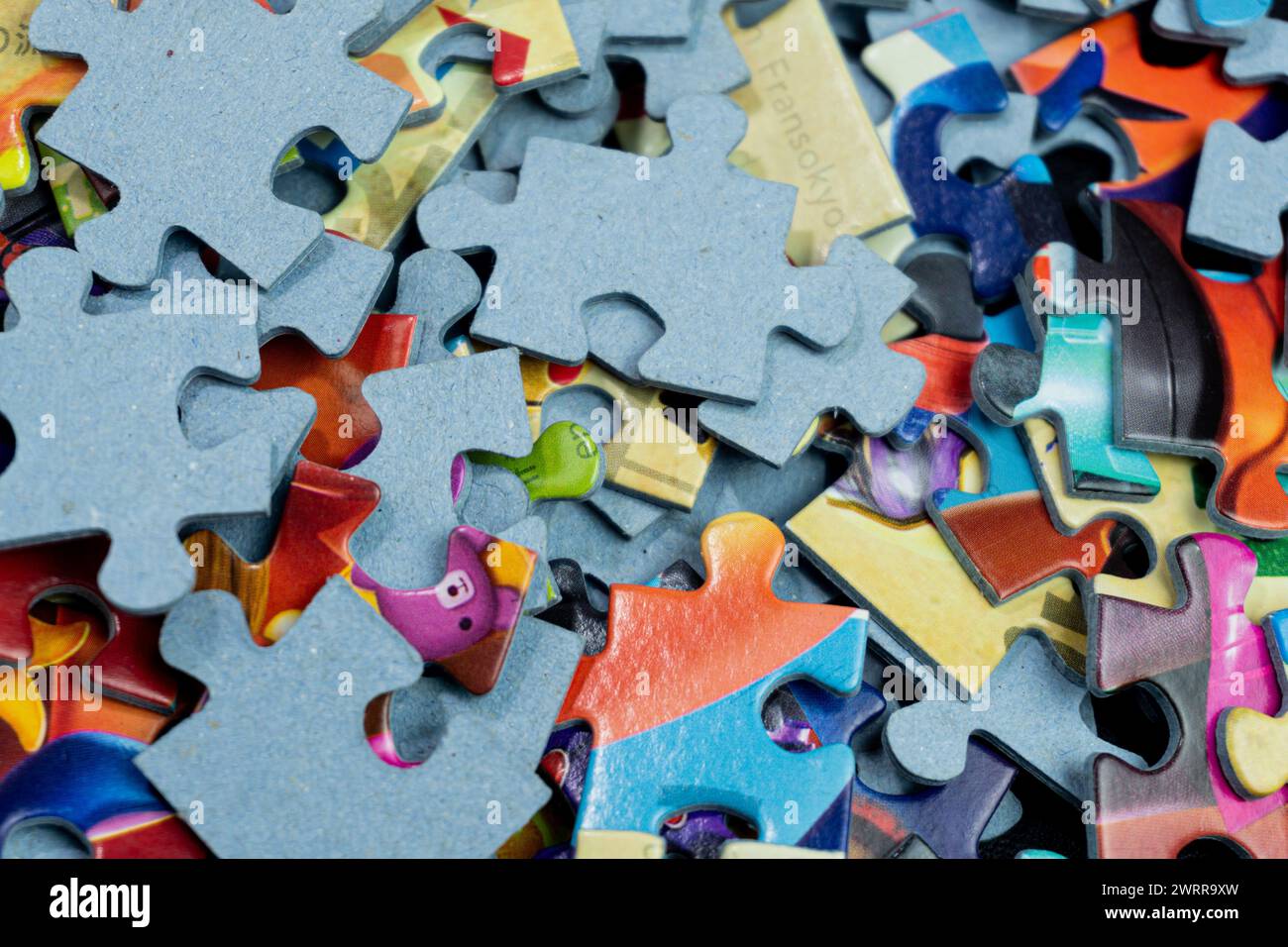 Stacked puzzle pieces that are not completed Stock Photo - Alamy