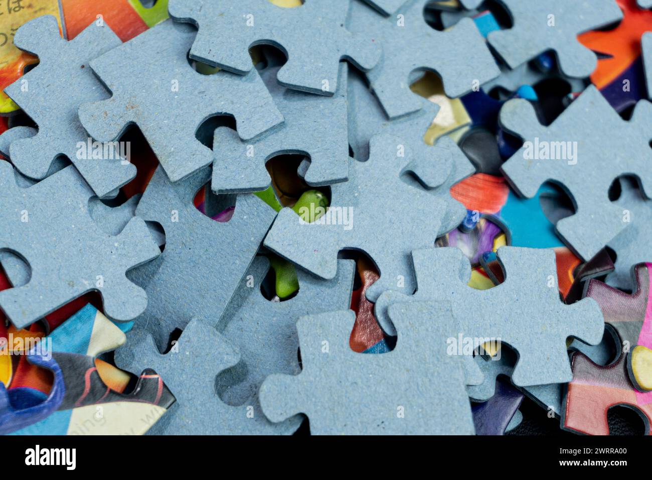 Stacked puzzle pieces that are not completed Stock Photo - Alamy