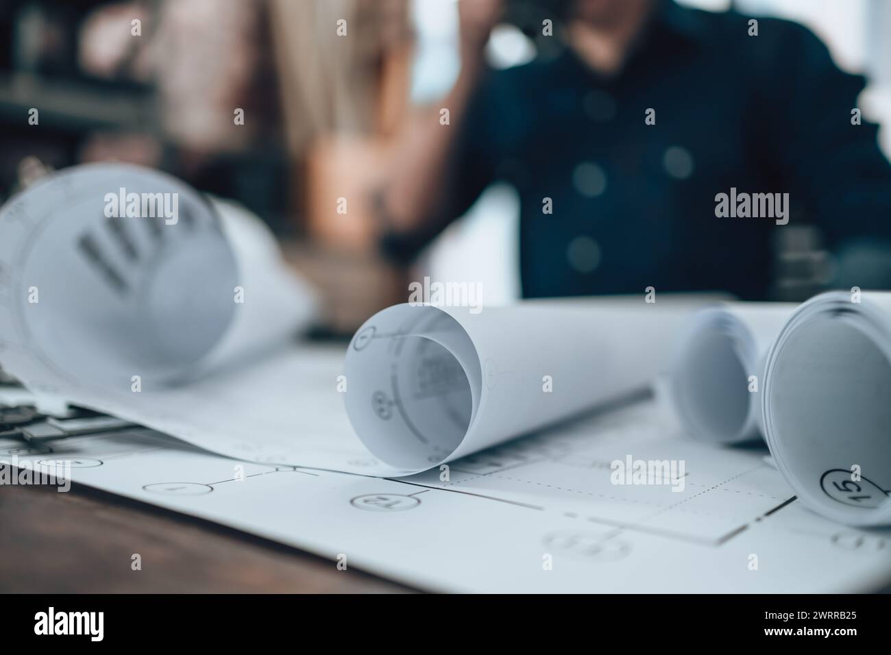 Engineering working with drawings inspection on the office desk and ...