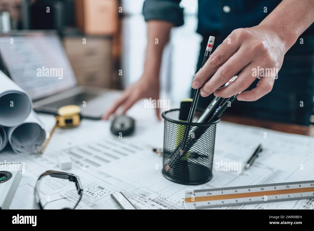 Engineering pick pencil from pencil case for drawings inspection on the ...