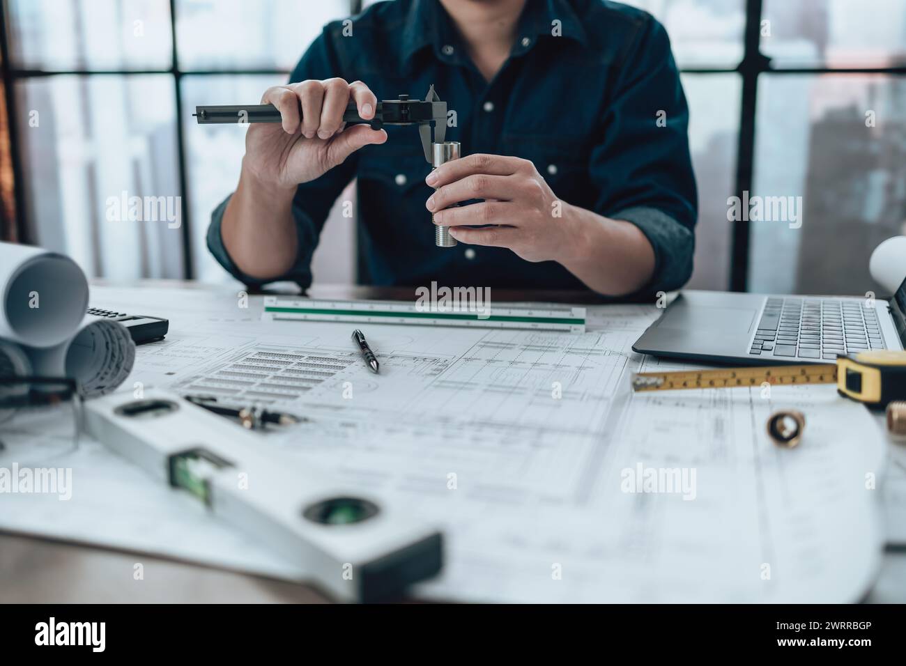 Engineering hands hold vernier caliper working and checking joint pipe ...