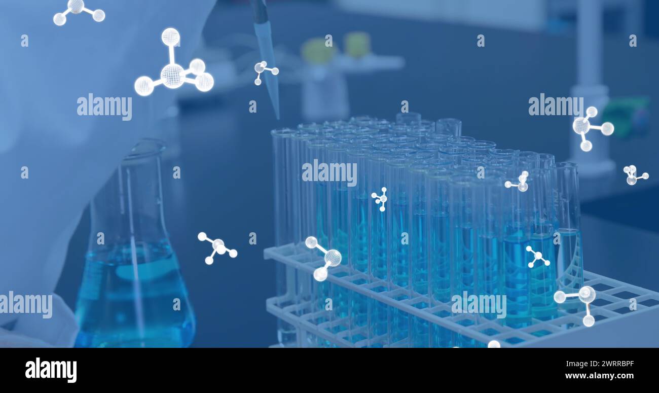 Image of molecules over caucasian scientist holding test tubes in lab ...