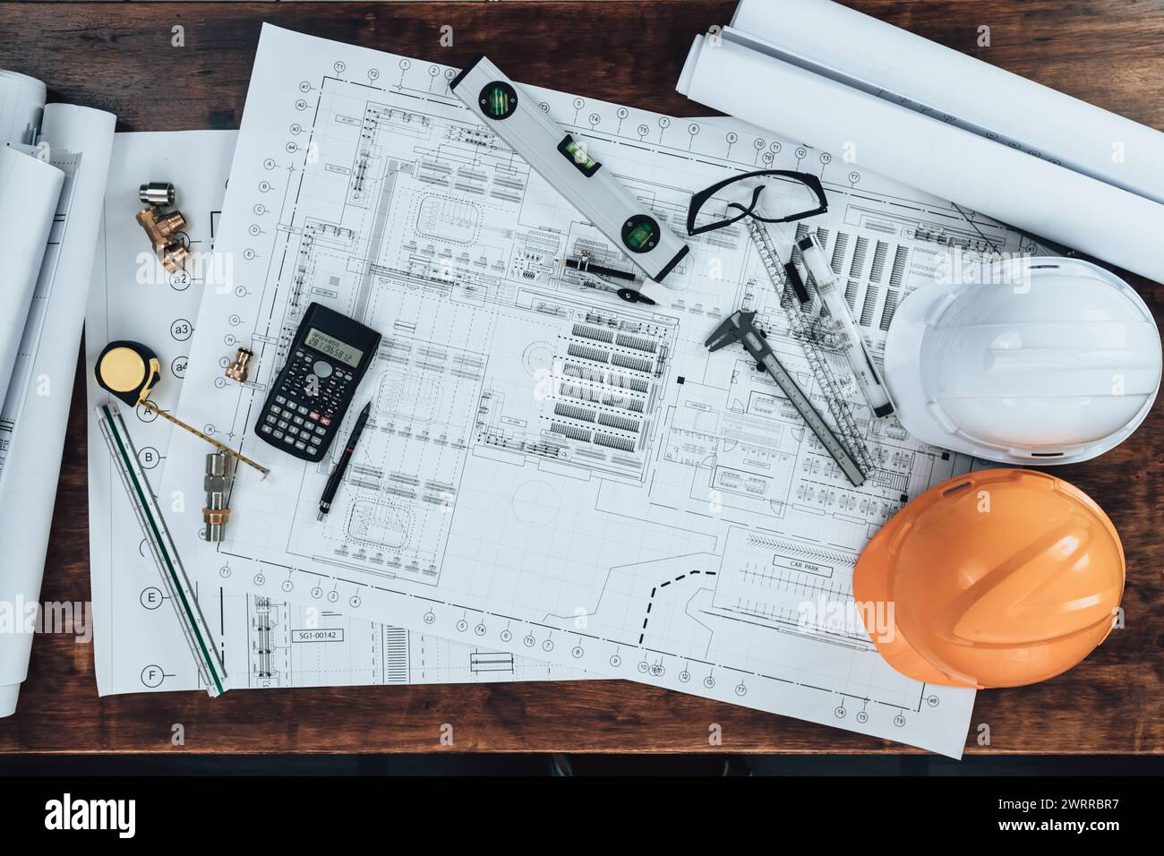 Top view Engineer tool Calculator, triangle ruler, safety glasses ...