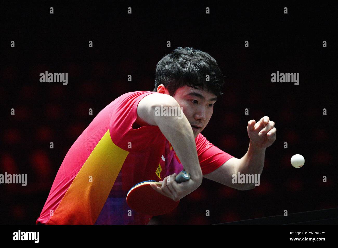 Singapore. 14th Mar, 2024. Liang Jingkun of China hits a return during ...