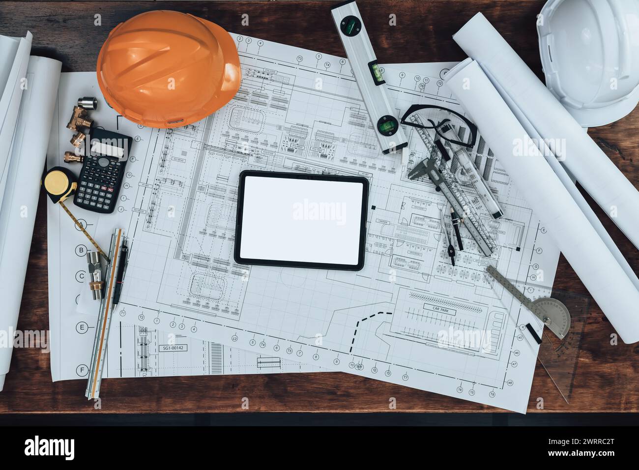 Engineering working with drawings inspection on the office desk and ...