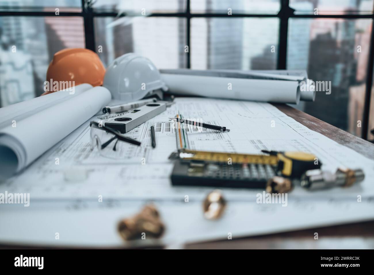 Engineering working with drawings inspection on the office desk and ...